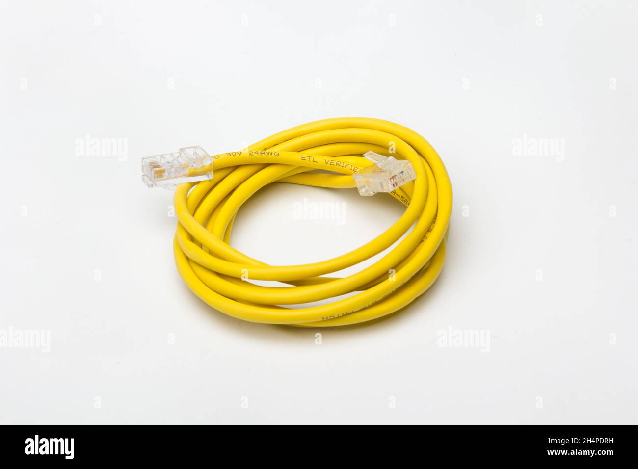 yellow communications cable, coiled to create a circle Stock Photo - Alamy