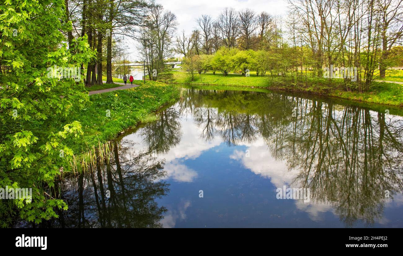 Beautiful river in the park, clear sky reflection Stock Photo - Alamy