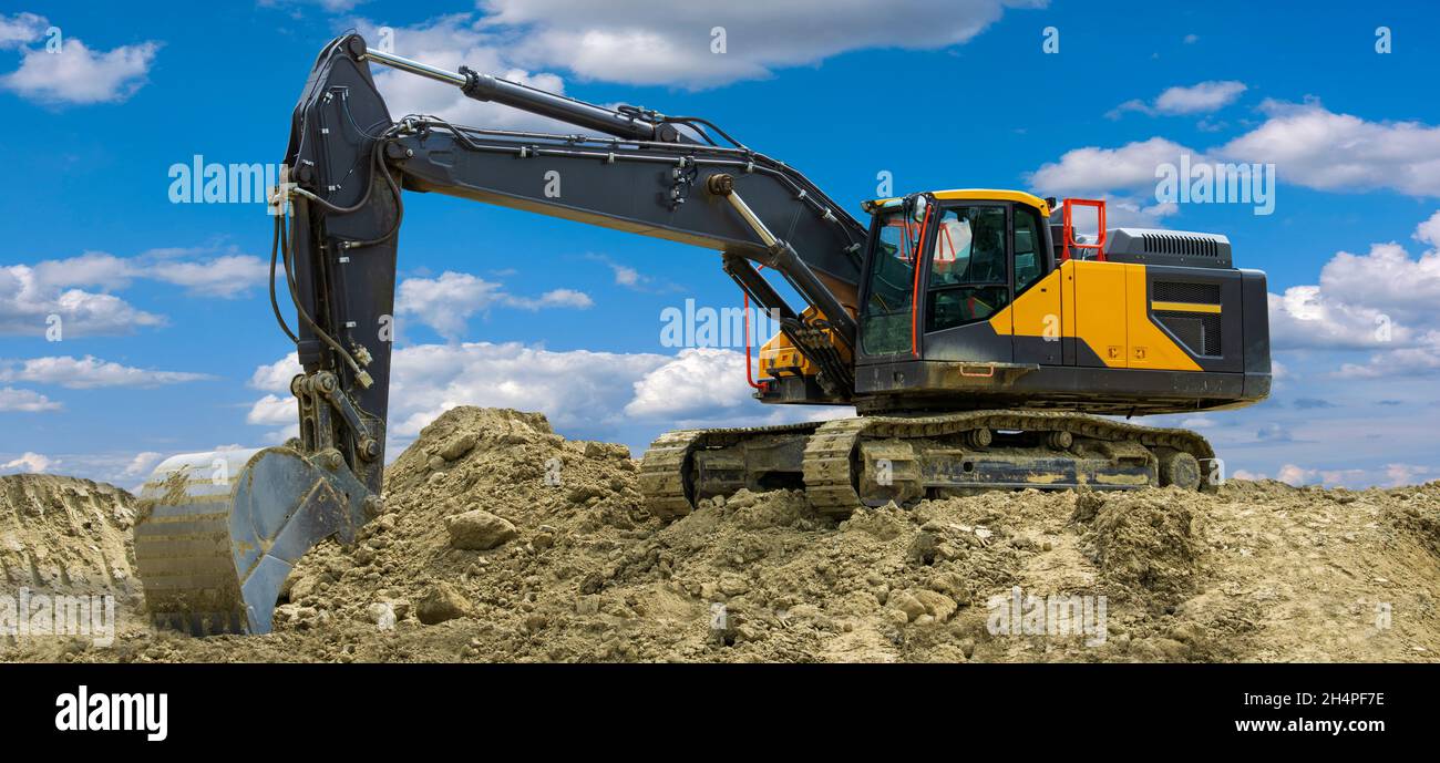 excavator at work on construction site Stock Photo - Alamy