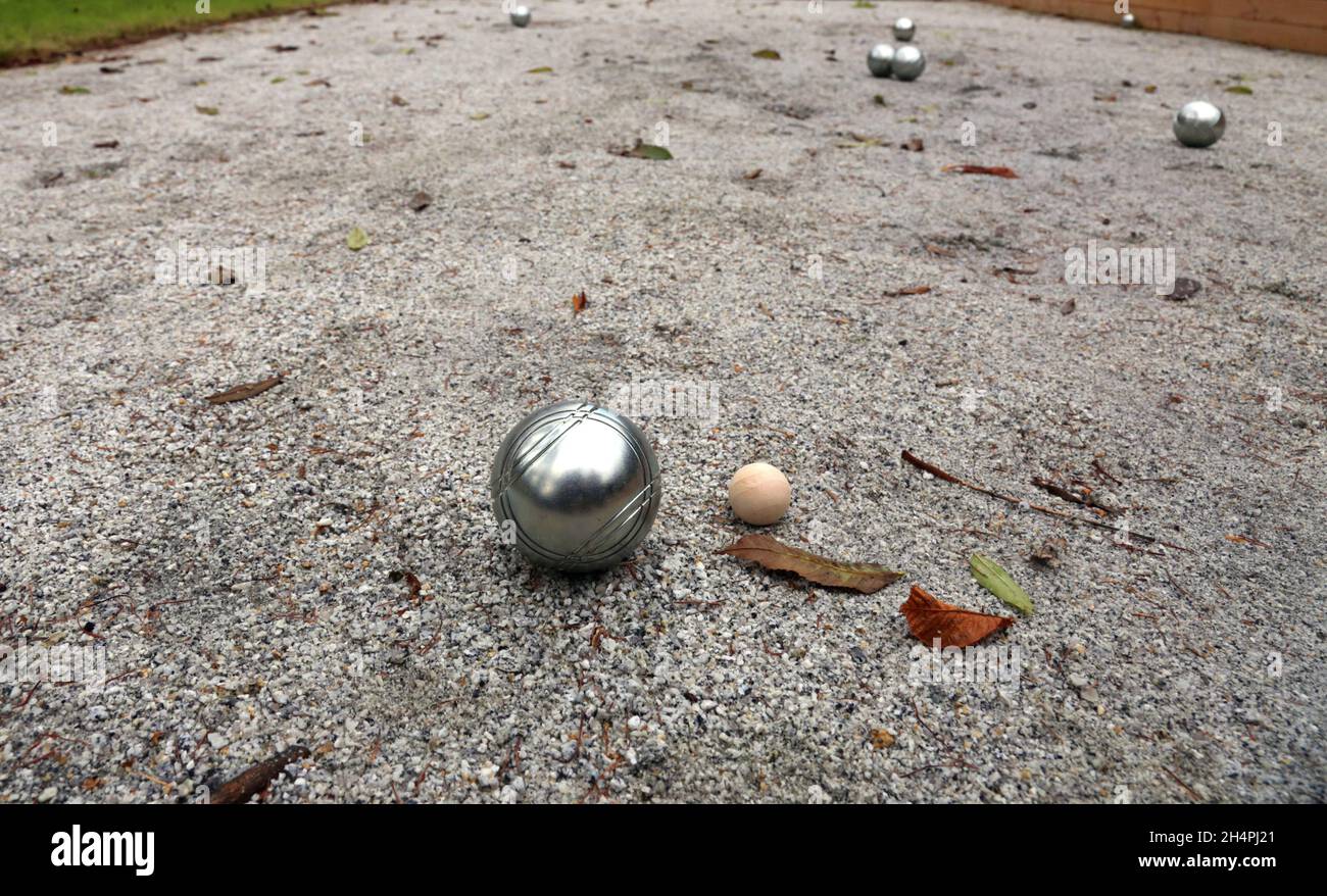 Cracow. Krakow. Poland. Petanque (game of boules) steel ball and small ...
