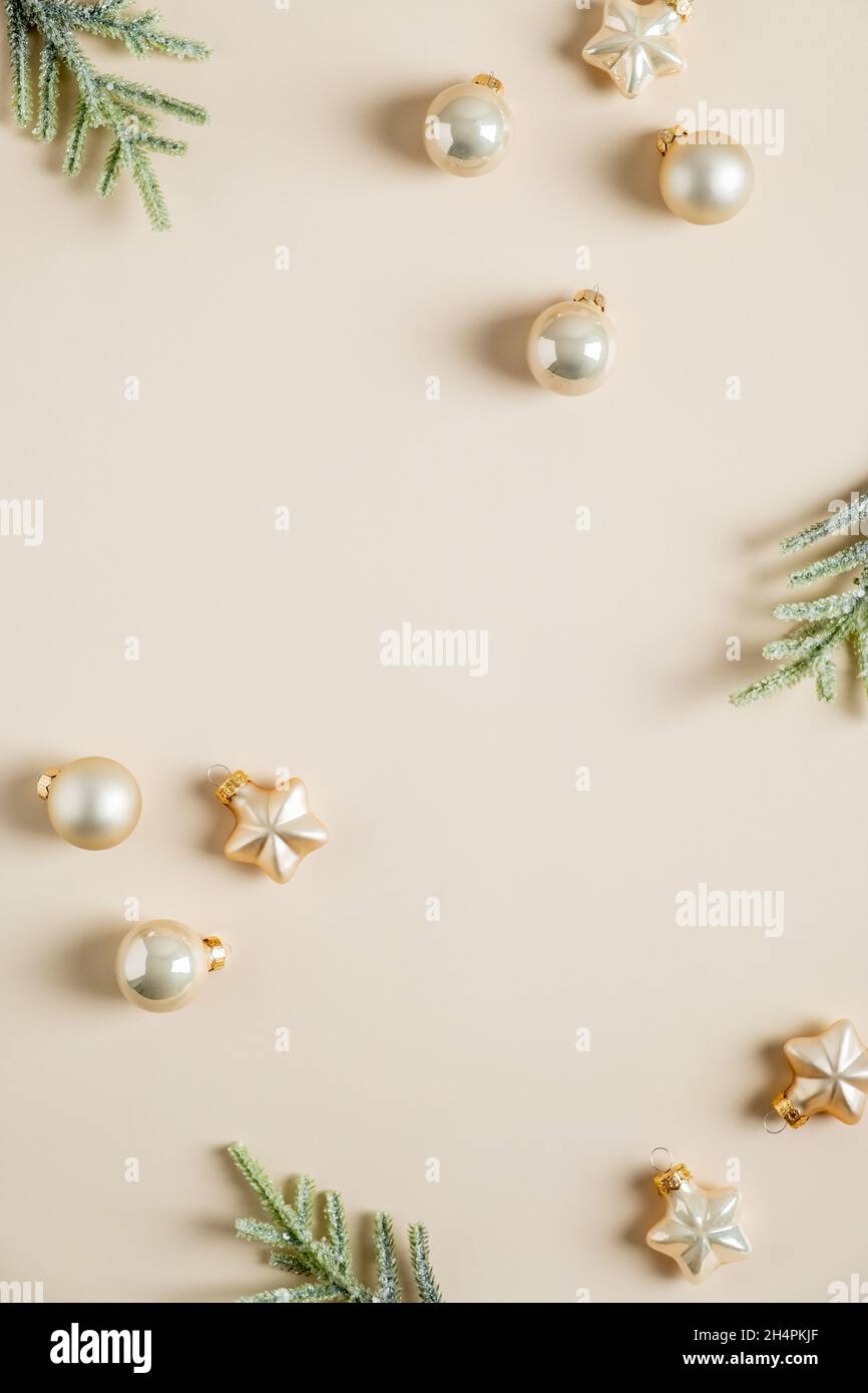 Minimal Christmas composition. Golden balls, stars, fir branches on ...