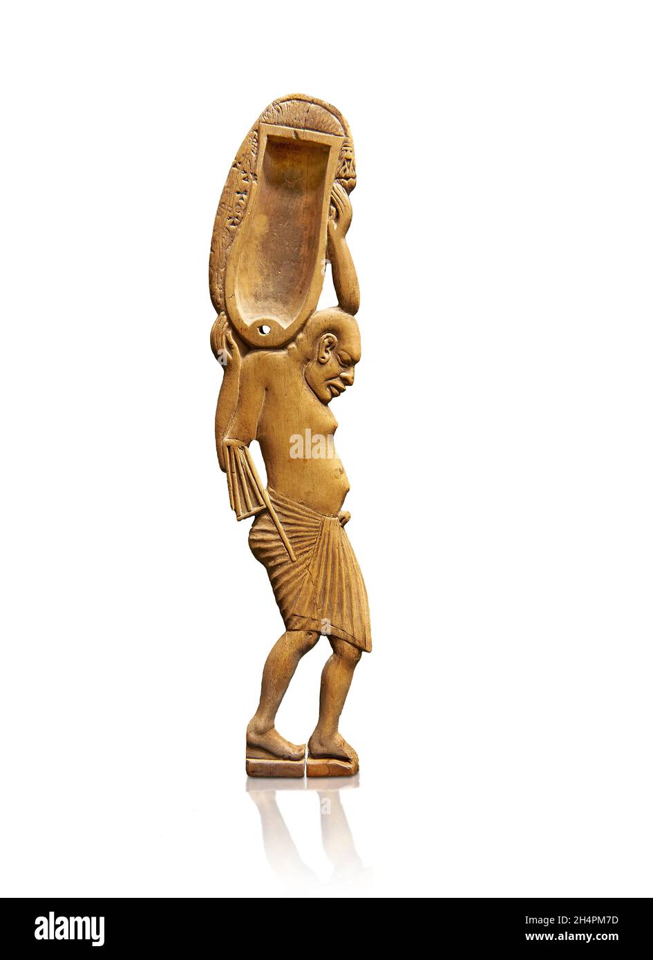 Ancient Egyptian shadow cosmetic spoon of a man carrying a container ...