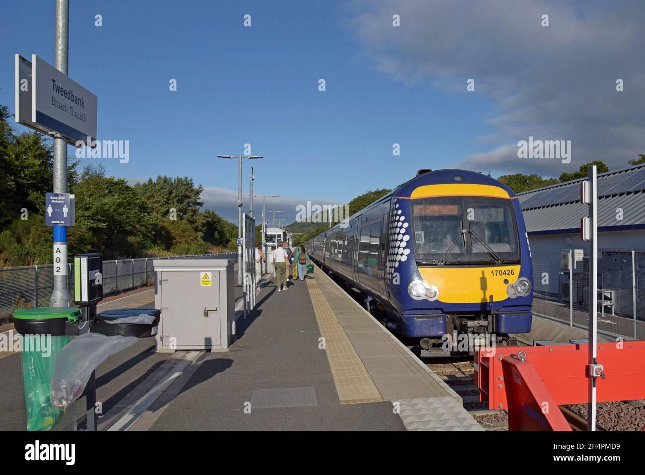Passenger walking along the platform ready to board a Scotrail train at ...