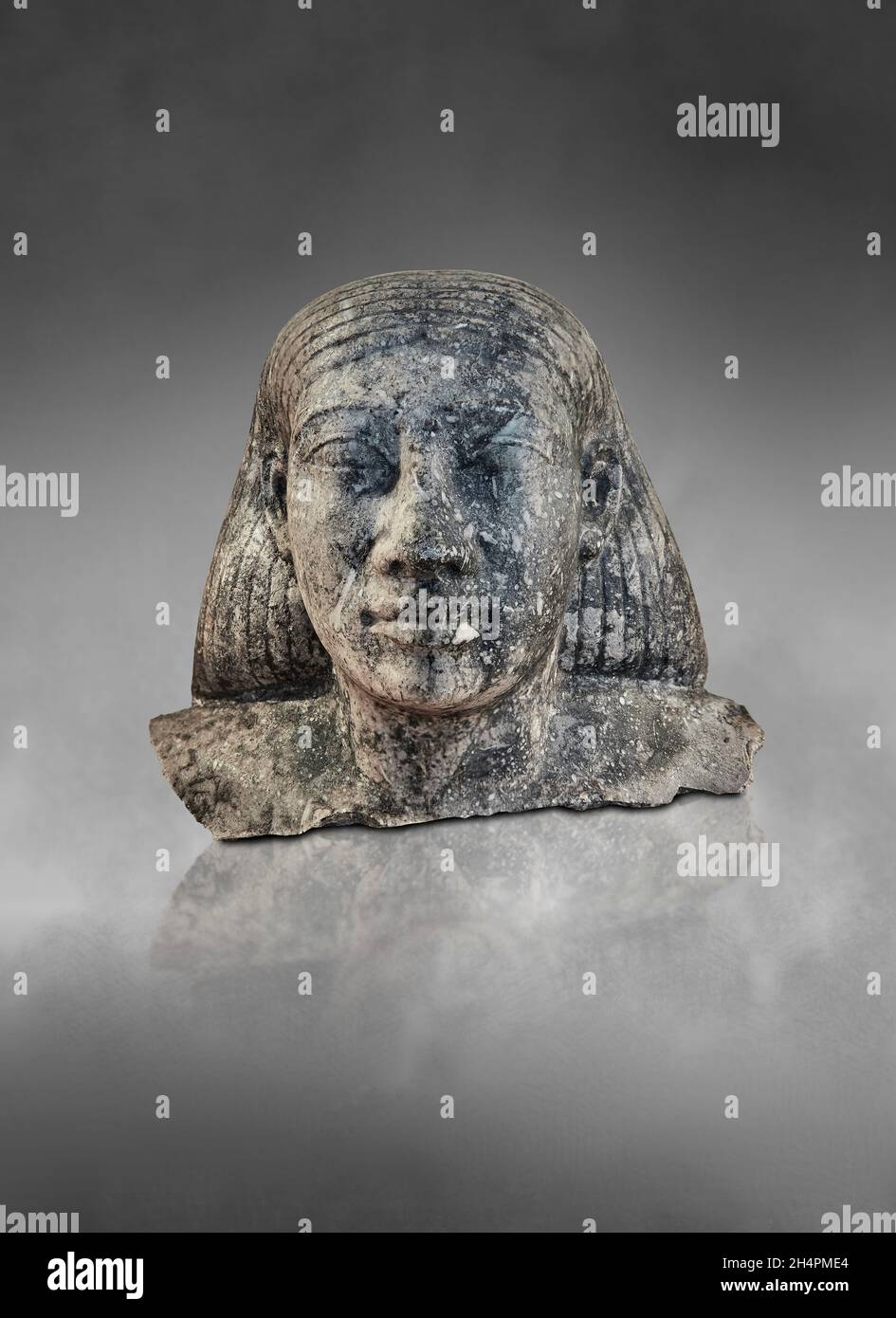 . Against grey art backgroundEgyptian statue sculpture of a mans head ...