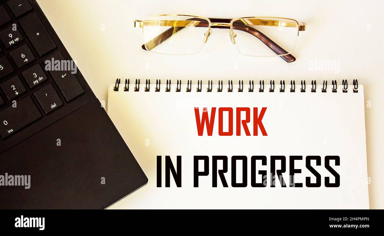 It is written on a notepad WORK IN PROGRESS , on a white background ...