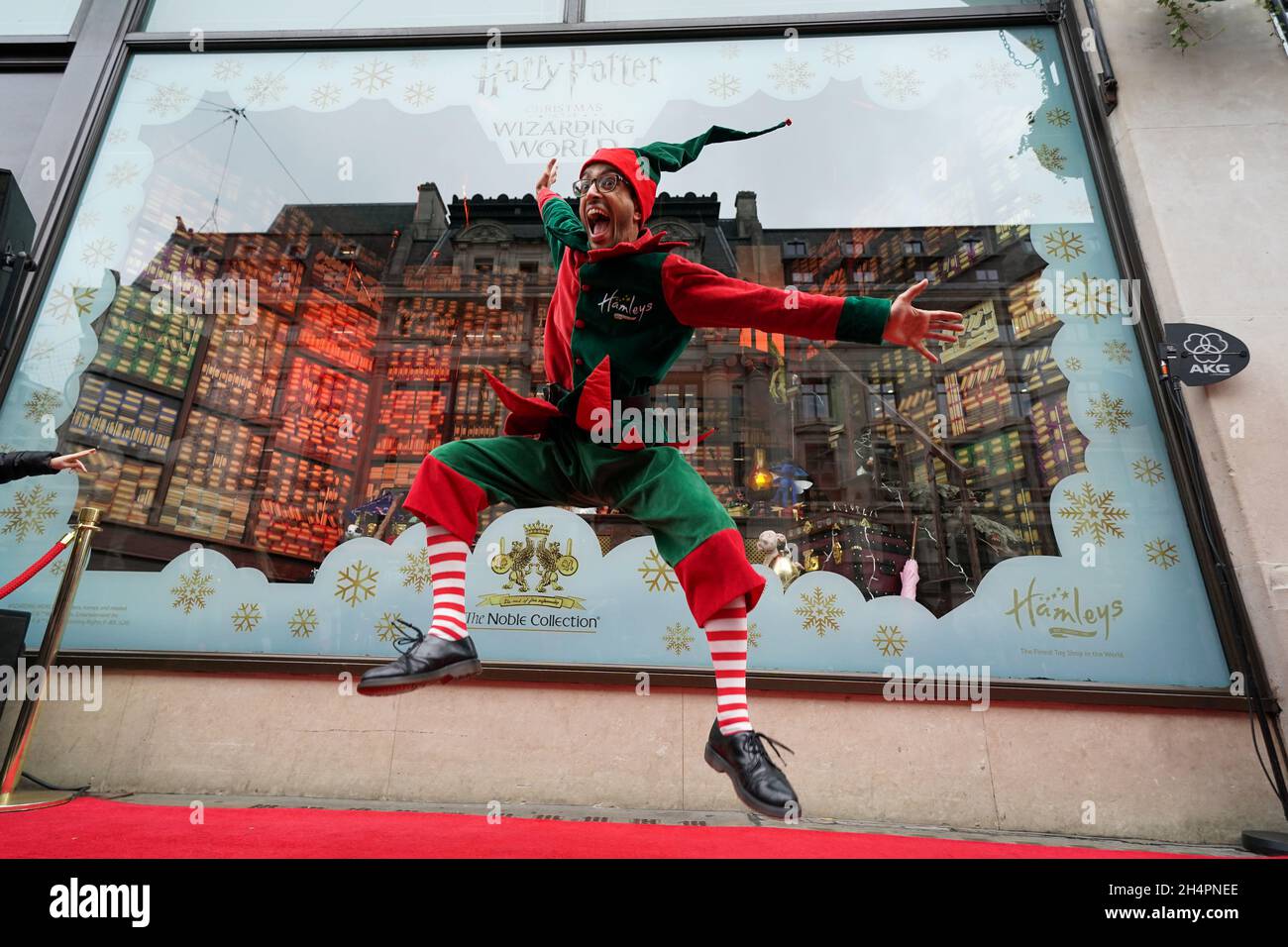 An elf performs during the unveiling of Hamleys' Christmas windows, in ...