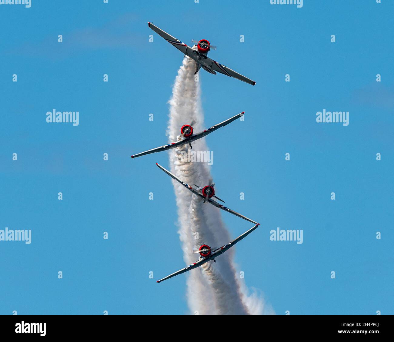 Low angle shot of airplane stunts on an airshow Stock Photo - Alamy