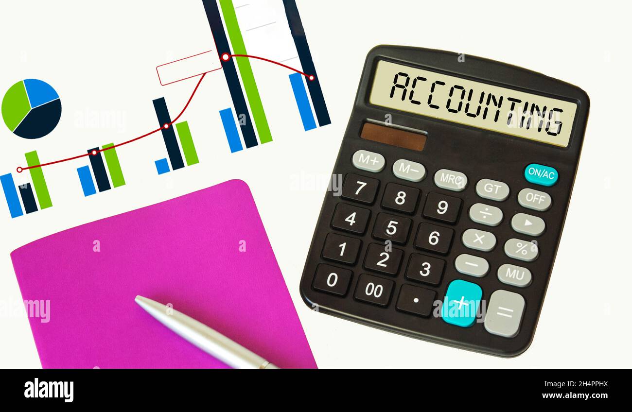 Calculator with the text ACCOUNTING on white paper, next to accounting ...
