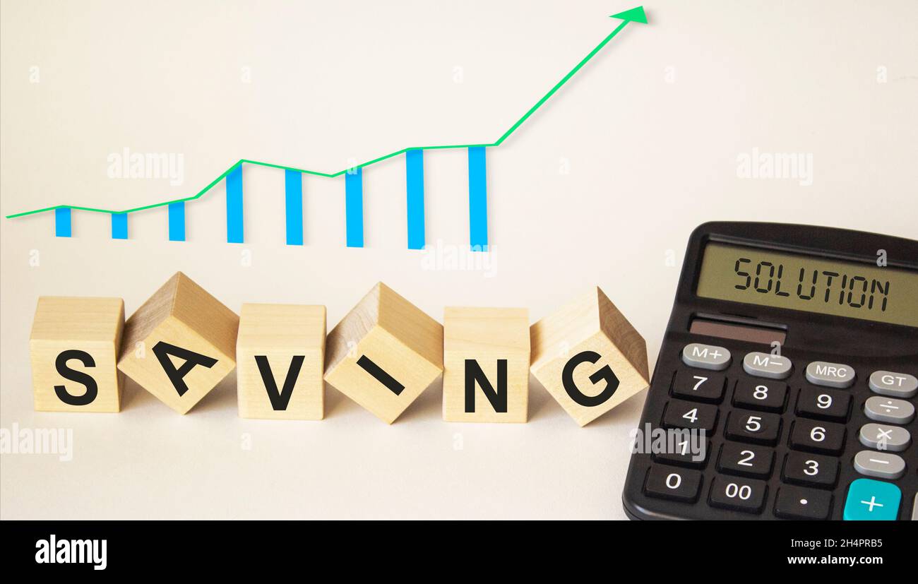 On a white background wooden cubes with the text save, graph and ...