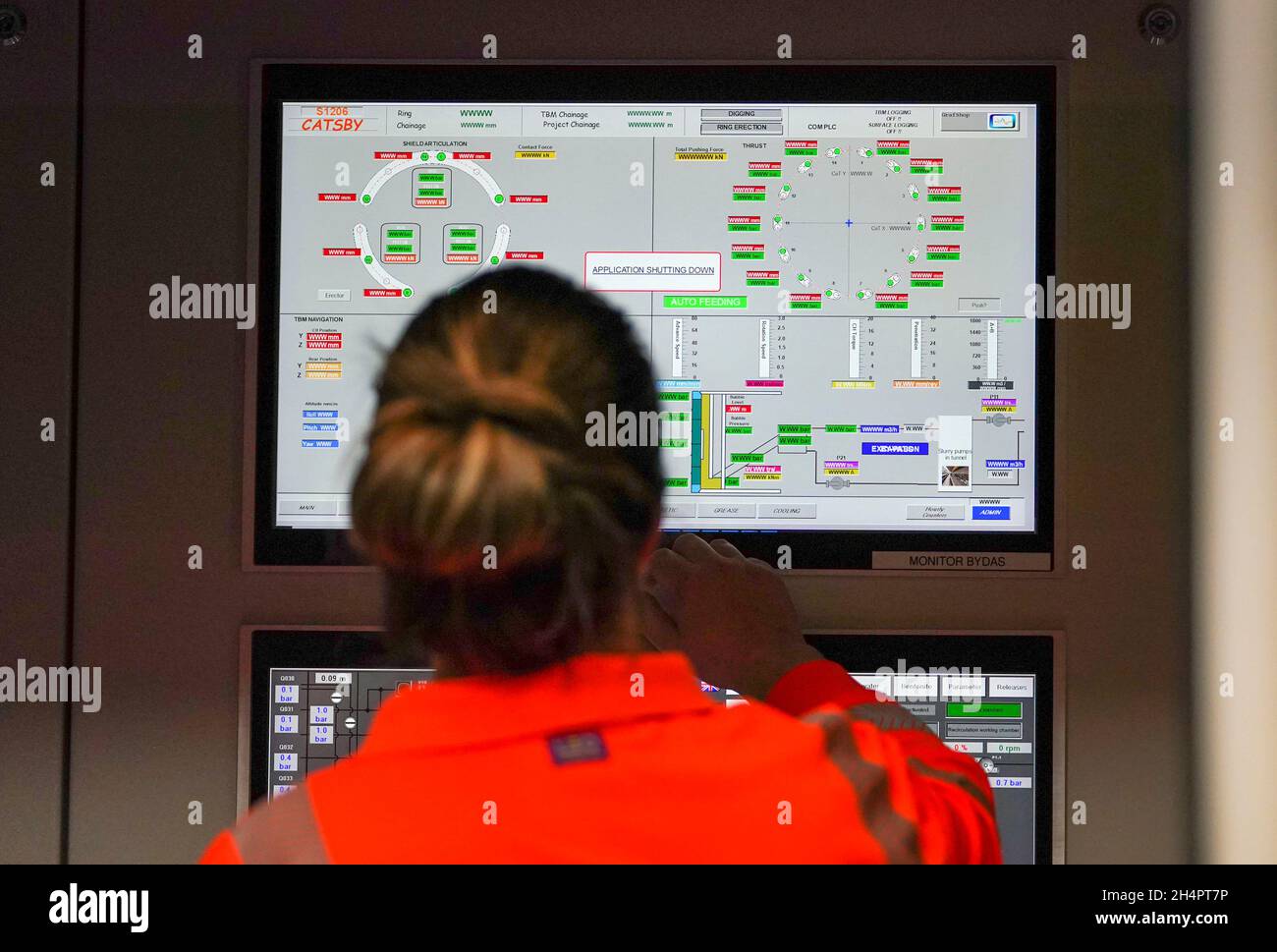A pilot looks out controls on one of the two tunnelling machines at the ...