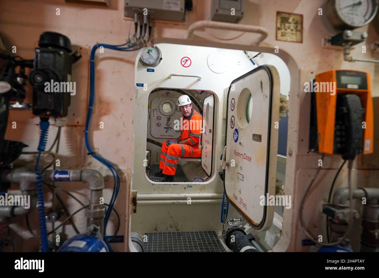 A Worker sits in the compression chamber on one of the two tunnelling ...