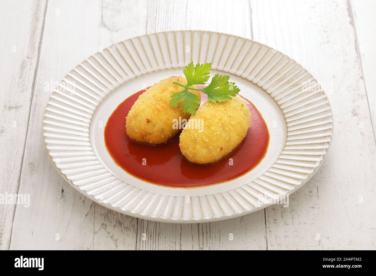 Japanese creamy croquettes that contents are crab meat and bechamel ...