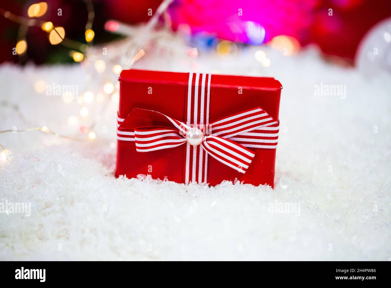 Christmas present in the snow, merry Christmas, lights Stock Photo - Alamy