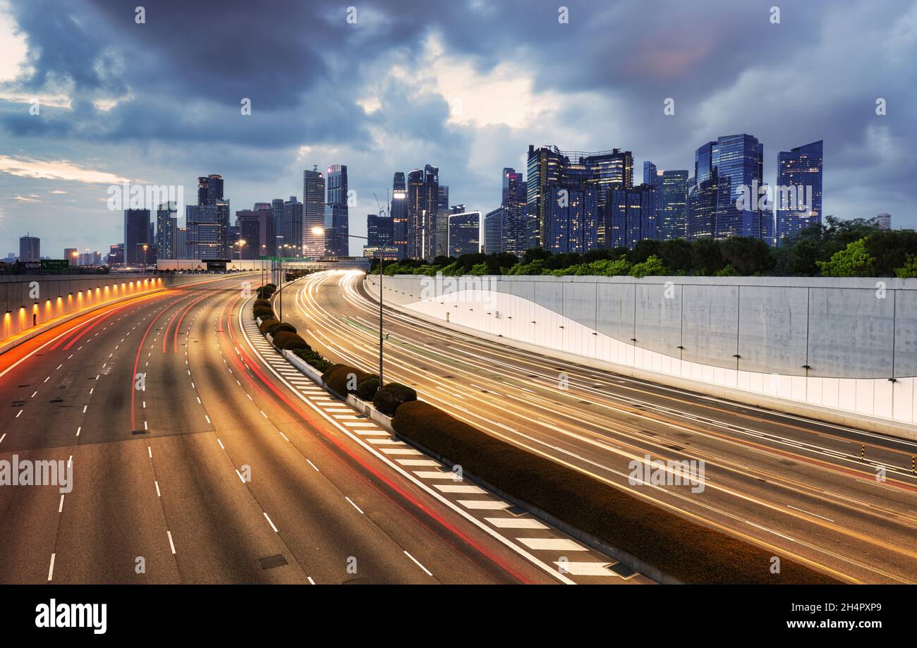 Singapore traffic at twilight - financial downtown Stock Photo - Alamy