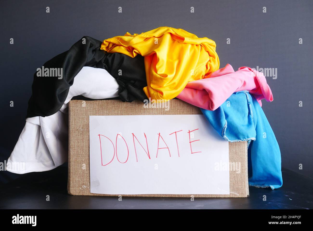 Donation box clothes on wooden hi-res stock photography and images - Alamy