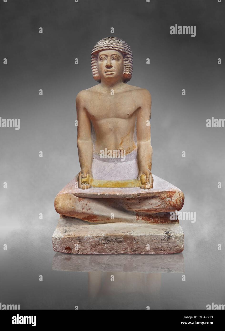 Egyptian statue sculpture of a seated crossed legged scribe with a ...
