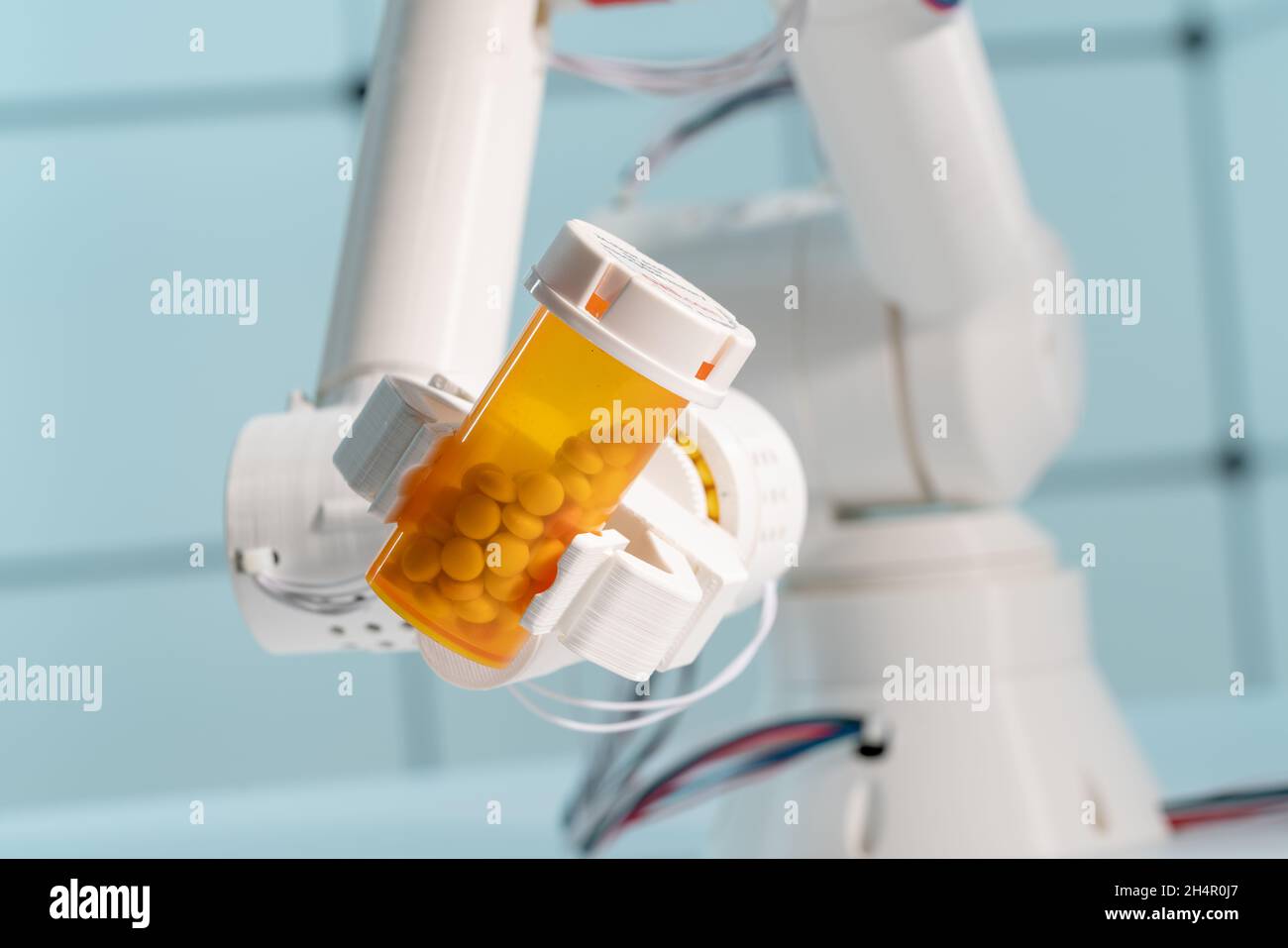 Robot arm with a pills tablets in bottle in the laboratory Stock Photo ...