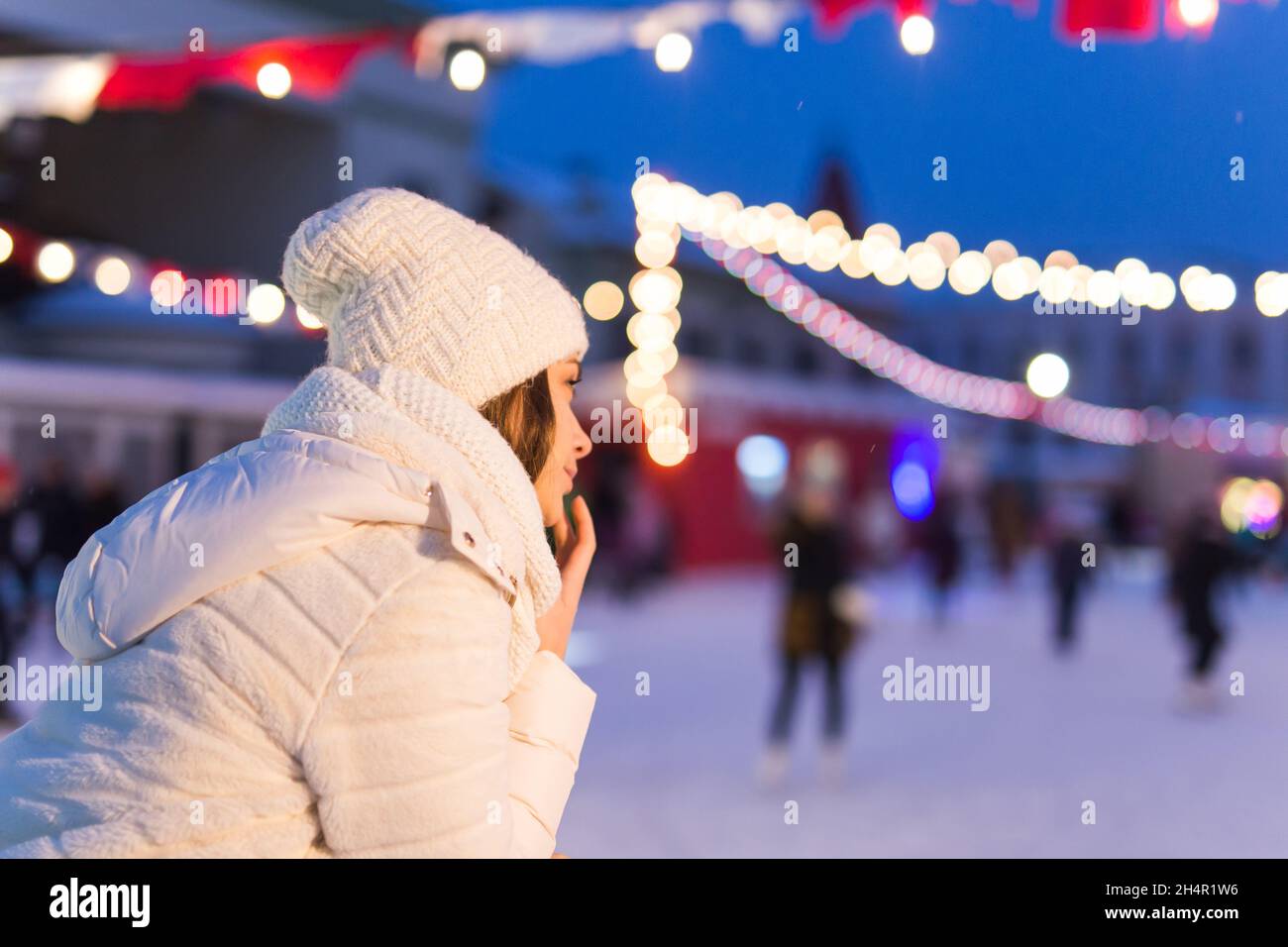 Christmas, winter, technology and leisure concept - happy young woman ...