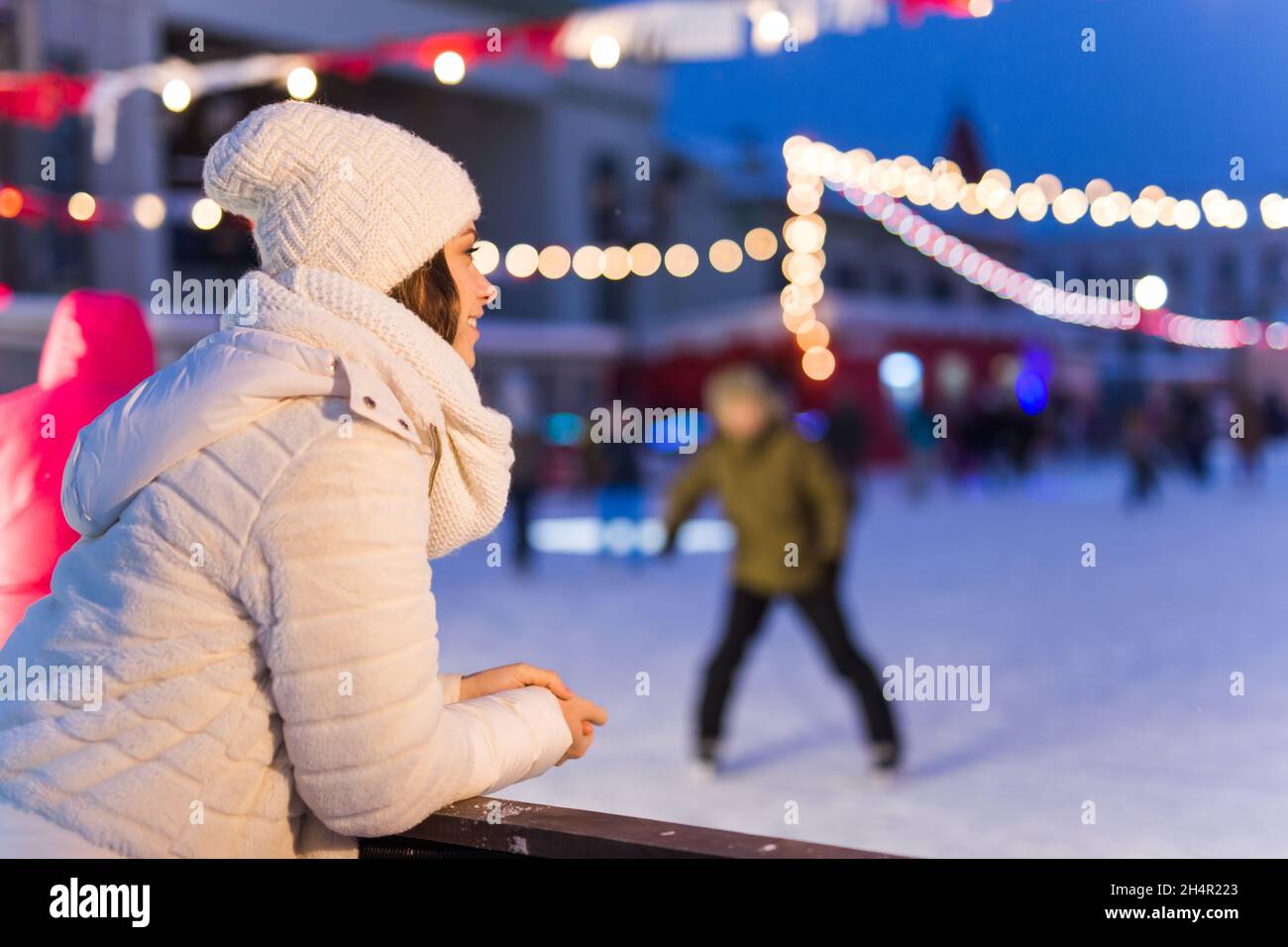Christmas, winter, technology and leisure concept - happy young woman ...