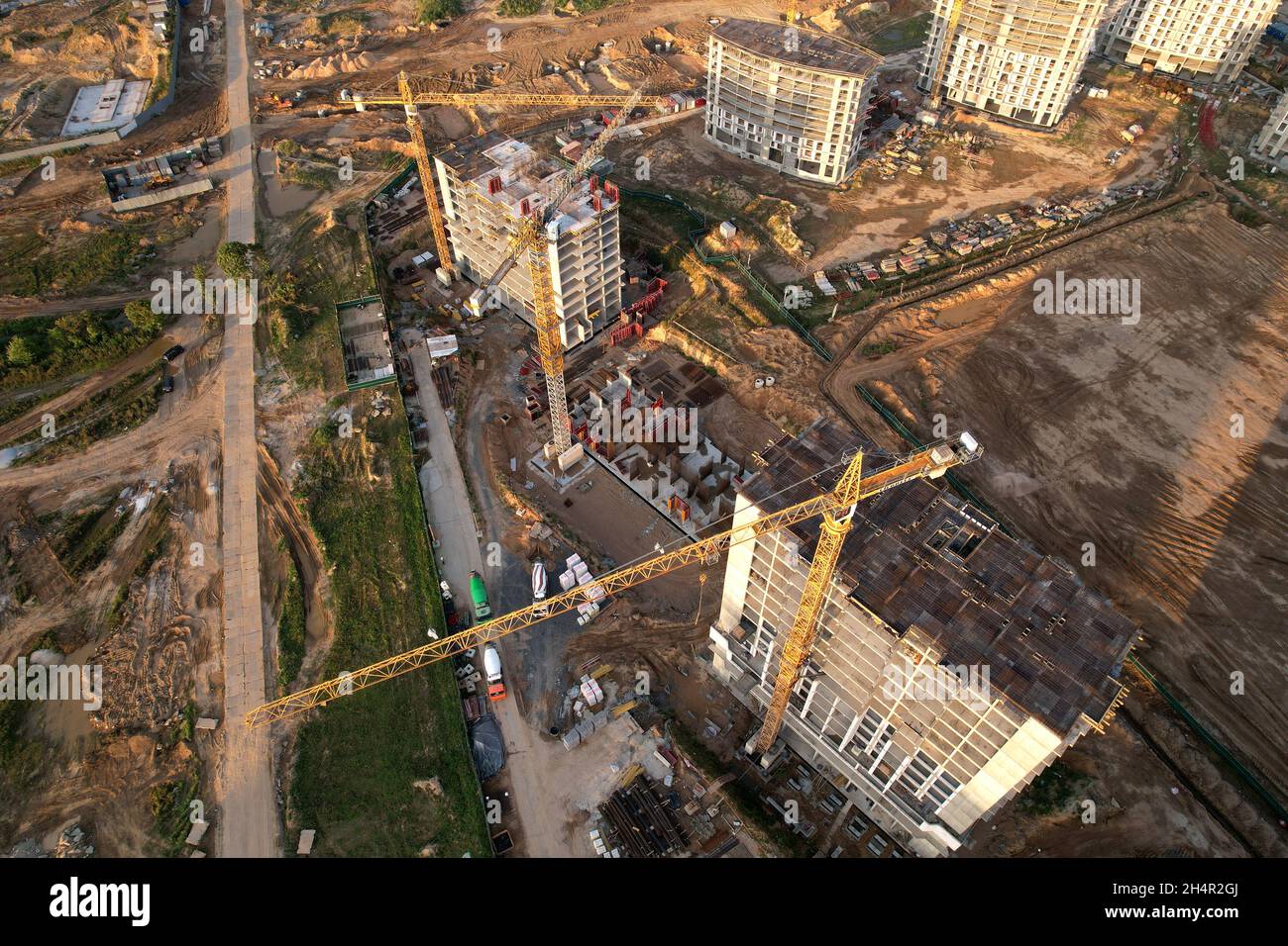 Tower crane working at large construction site. Top view of the the ...