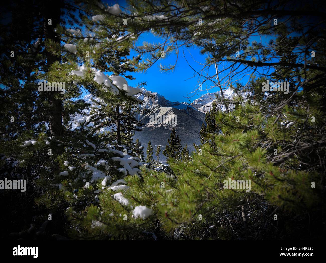Mountain top seen from natures peak hole Stock Photo - Alamy