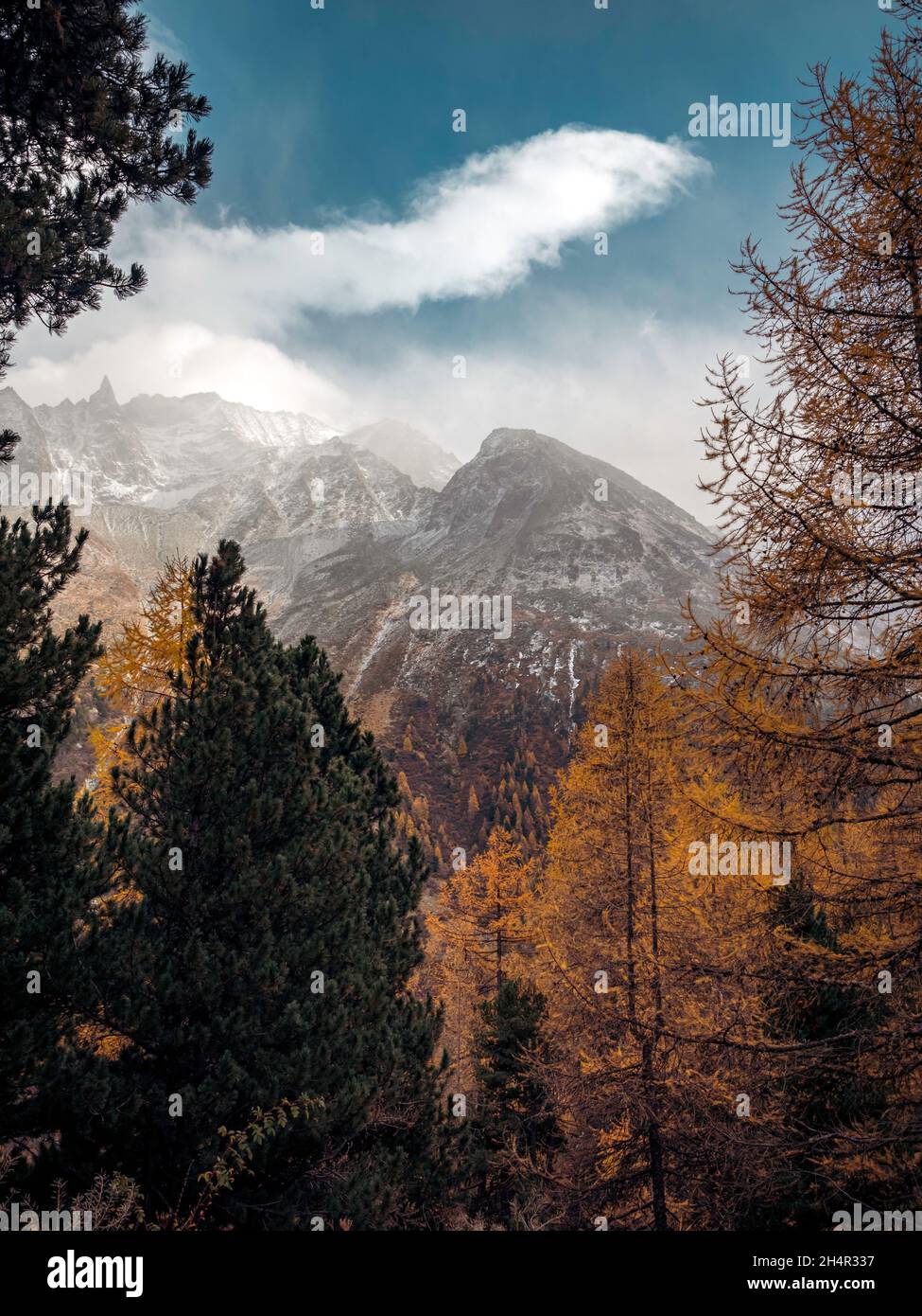 Amazing views over an high alpine valley and snow covered mountains ...