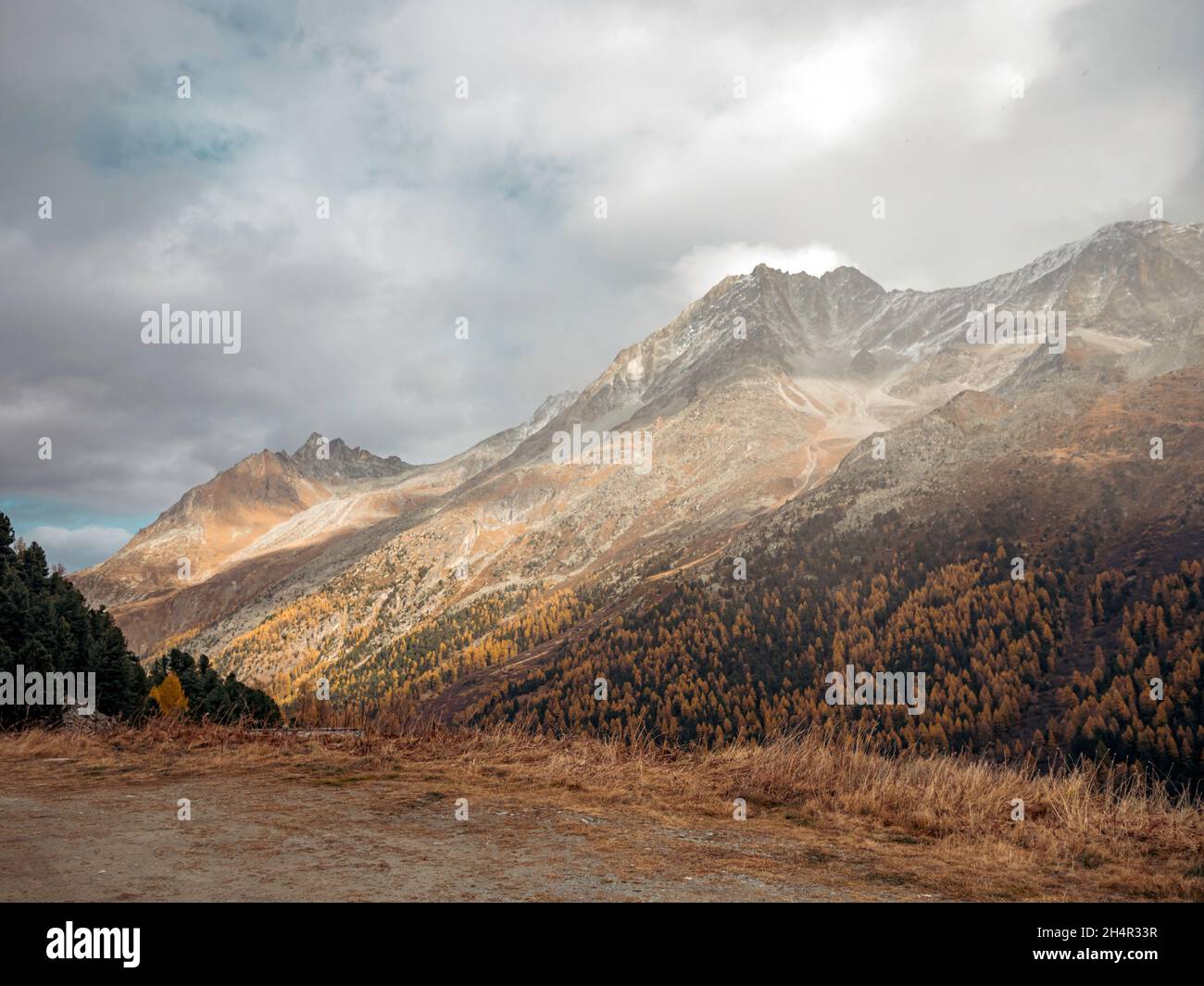 Amazing views over an high alpine valley and snow covered mountains ...