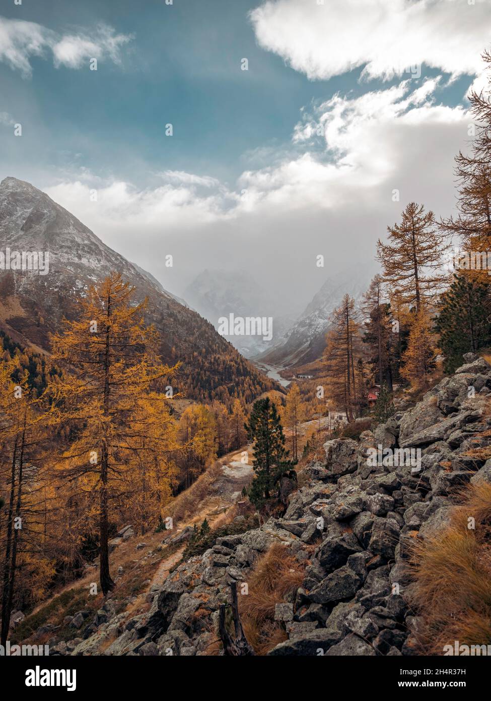 Amazing views over an high alpine valley and snow covered mountains ...