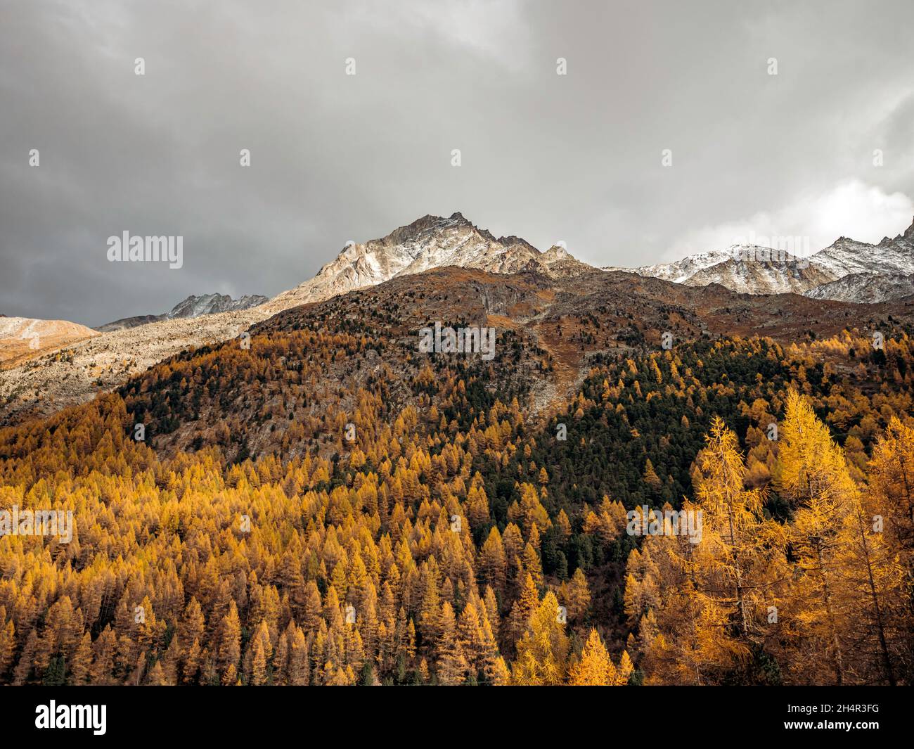 Amazing views over an high alpine valley and snow covered mountains ...