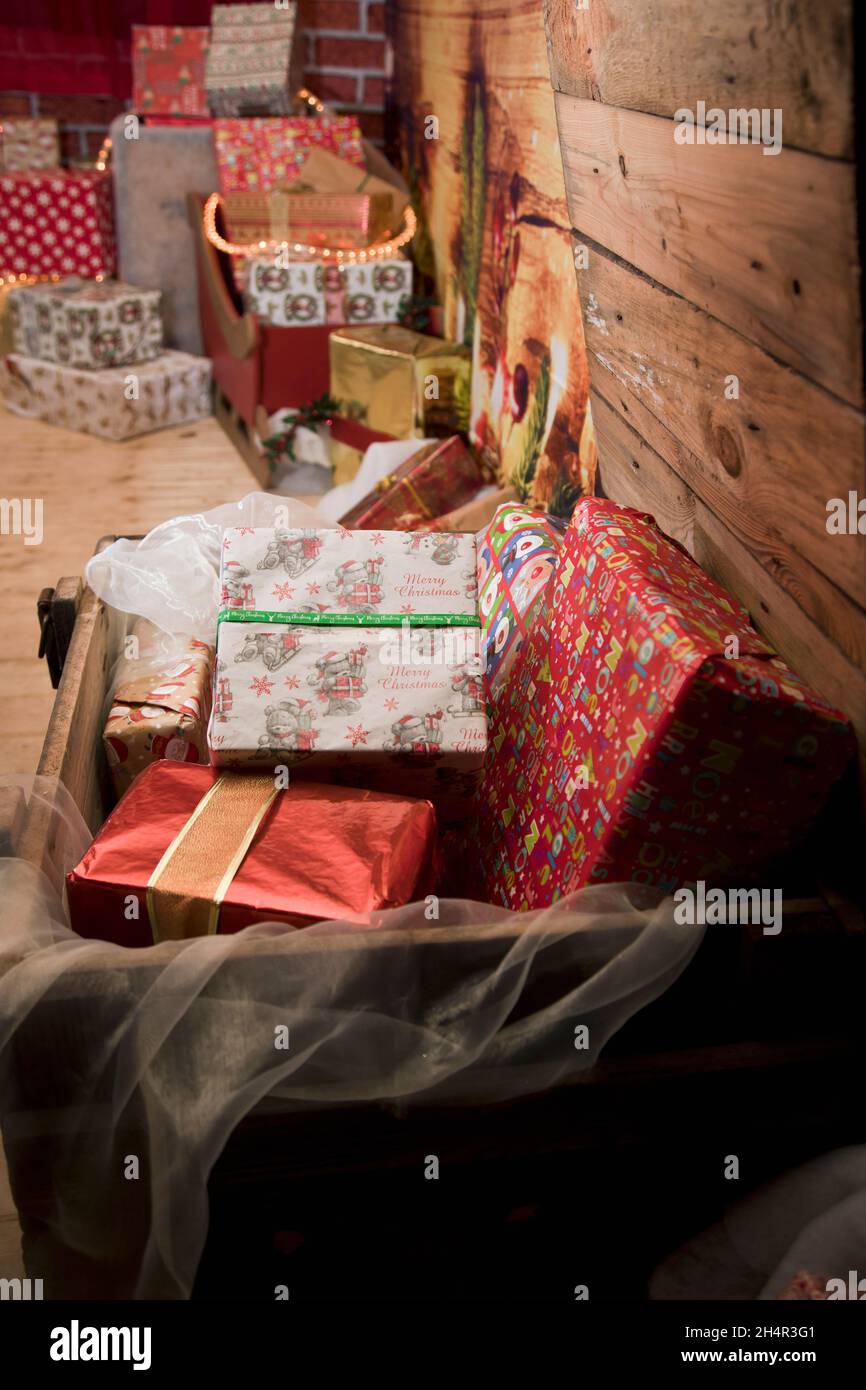 Assorted Christmas presents overflow from a wooden chest in 'Santa's ...