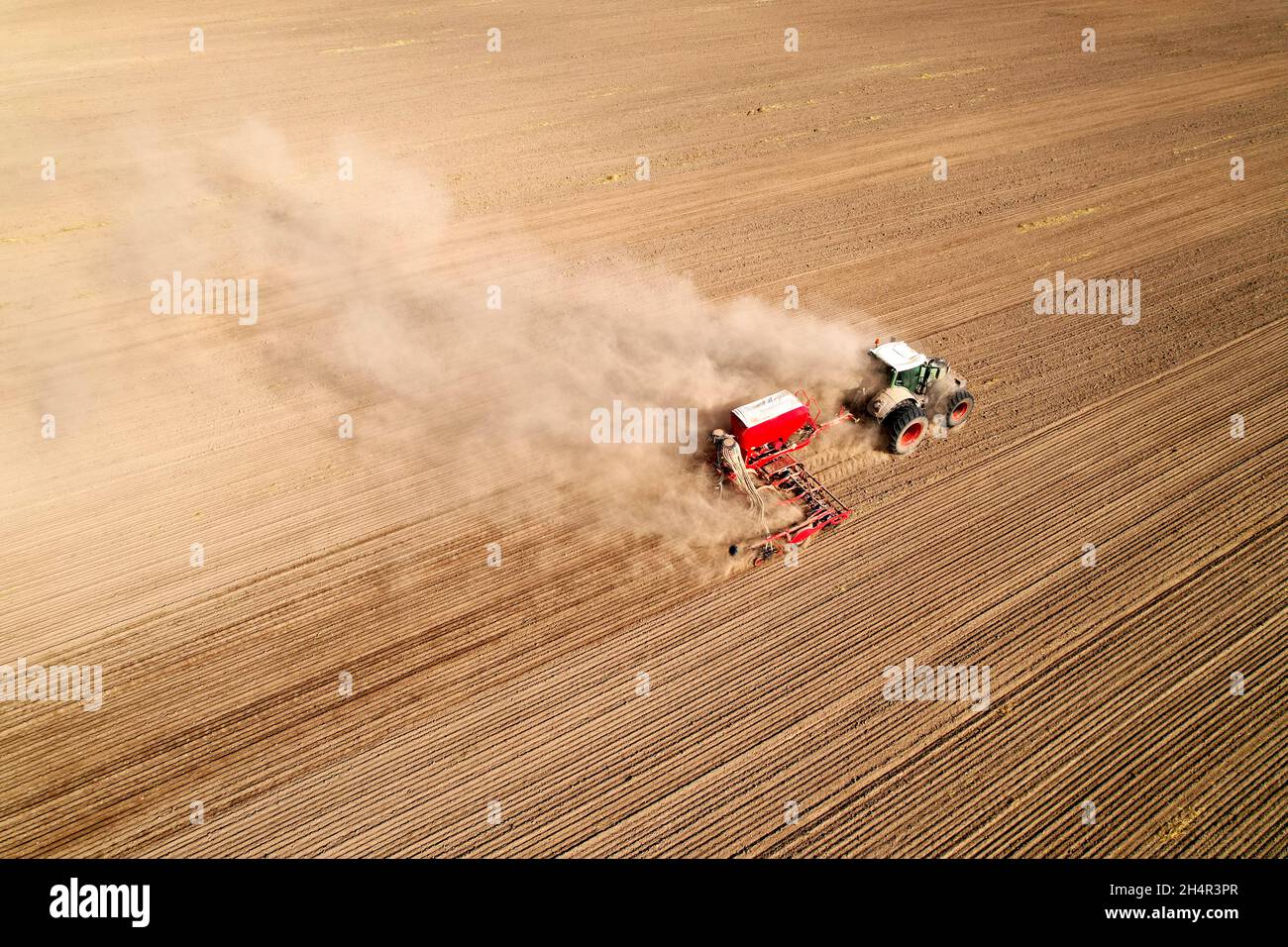 Tractor on sowing seed at field. Farming and seeding machine. Seeds ...