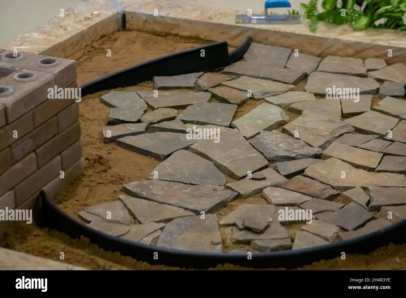 Unfinished garden paving slabs on sand - close up Stock Photo - Alamy
