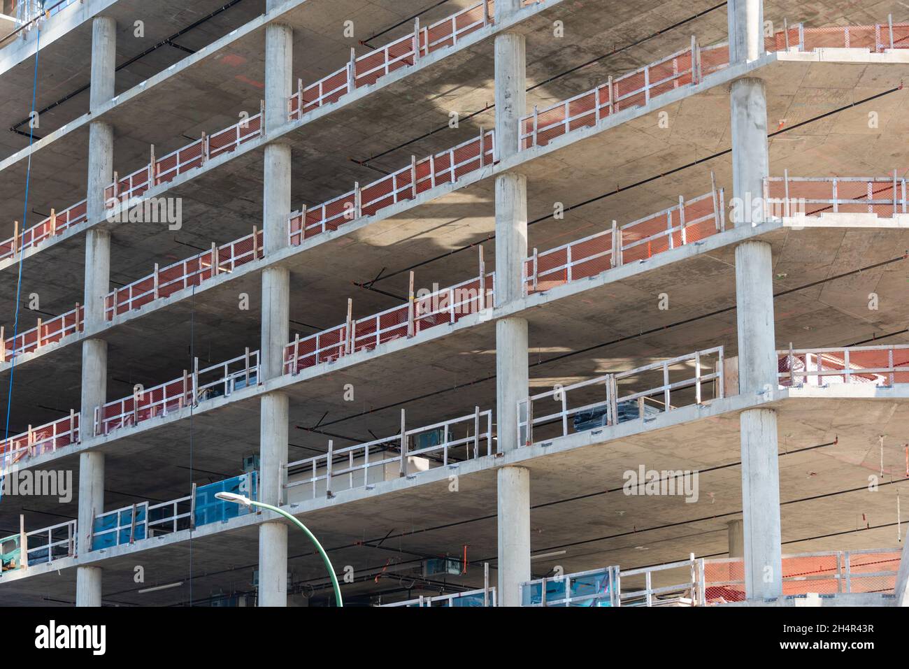 Facade of high-rise concrete building under constraction Stock Photo ...