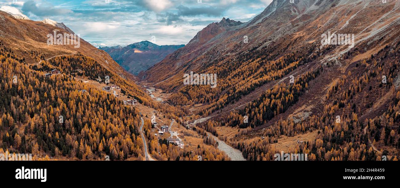 Amazing views over an high alpine valley and snow covered mountains ...