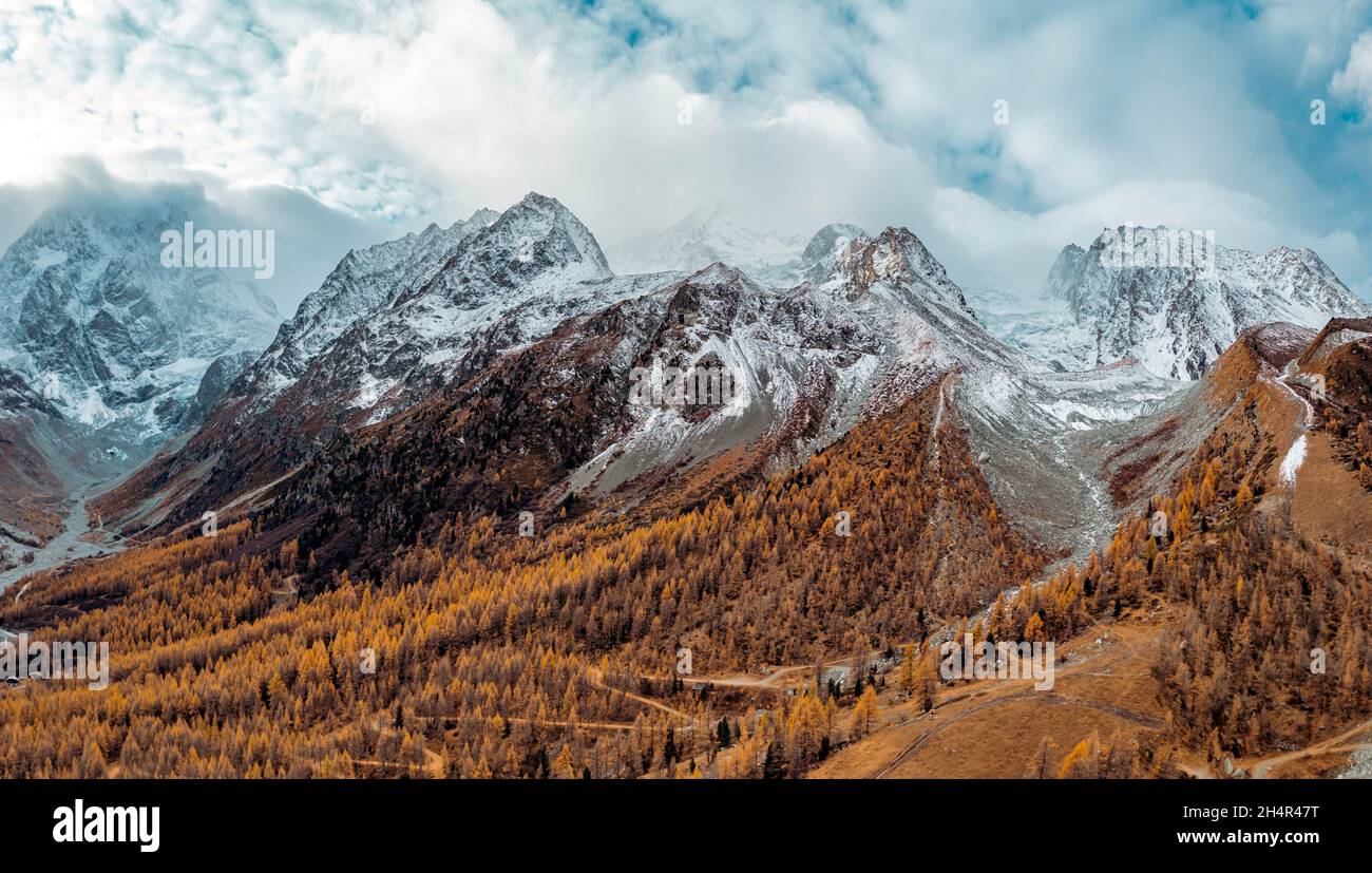 Amazing views over an high alpine valley and snow covered mountains ...