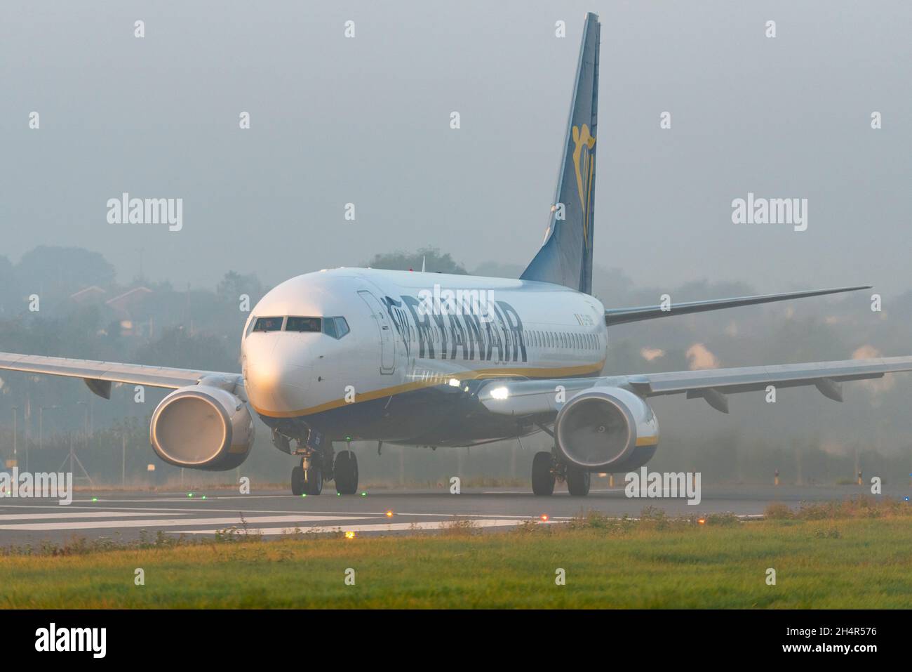 Ryanair 737 airliner jet plane powering up for an early morning flight ...