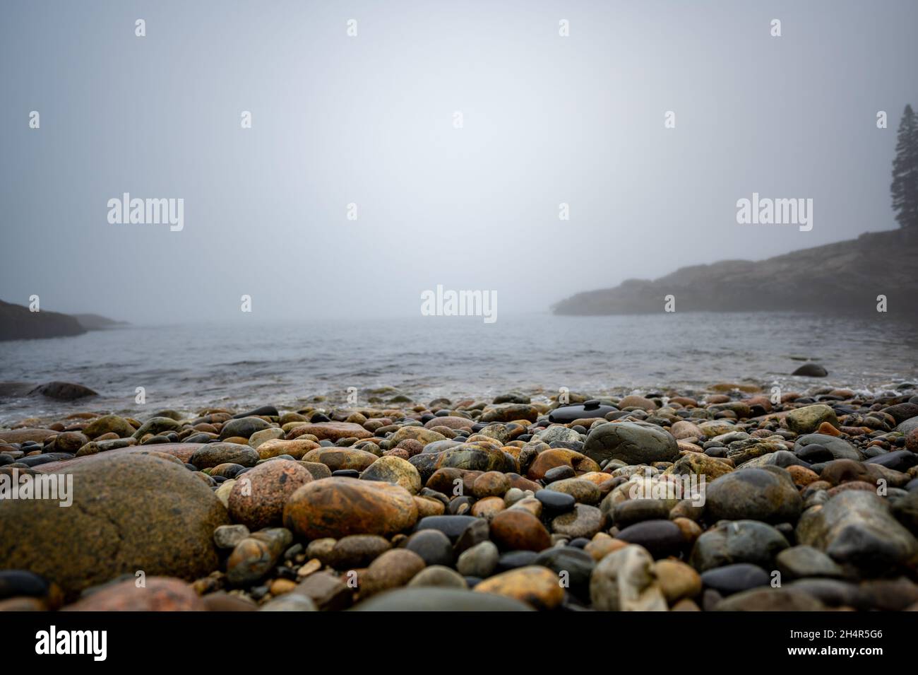 Multi-colored round rocks on Little Hunters Beach in Acadia National ...