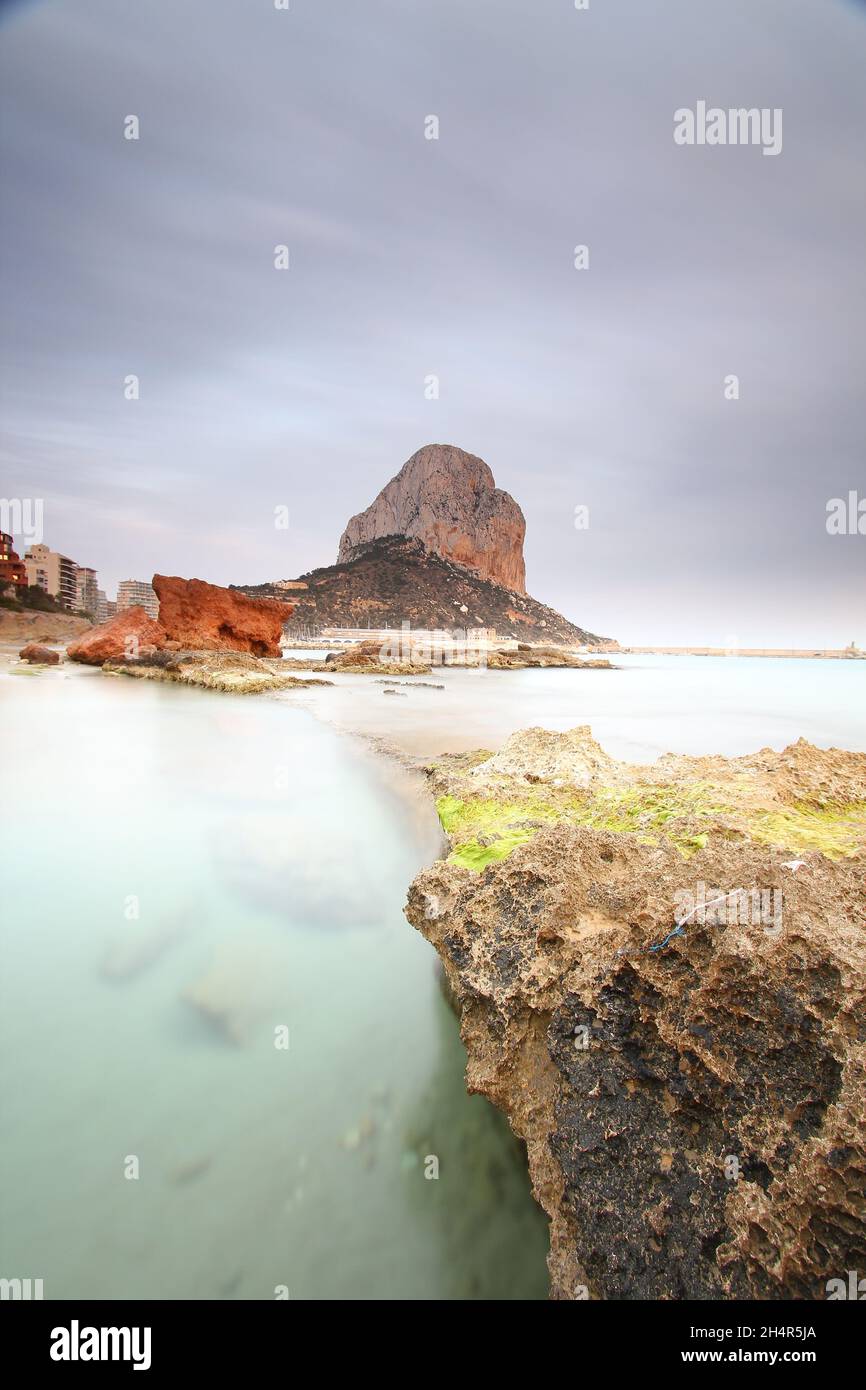 Beautiful view of a calm sea on the sunset sky background in Spain ...