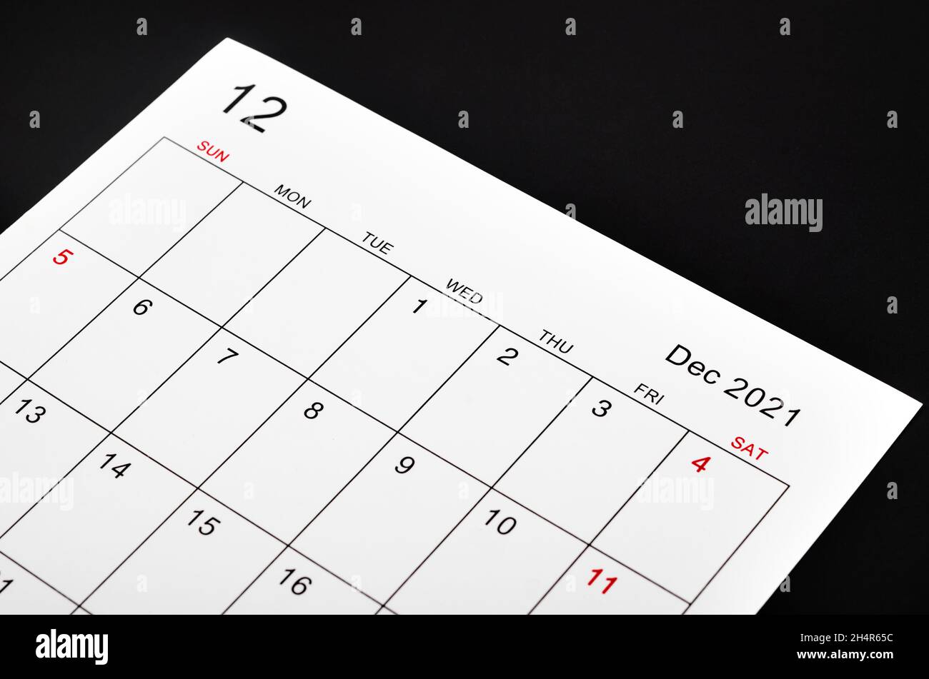 Close up December 2021 calendar sheet on black background Stock Photo ...