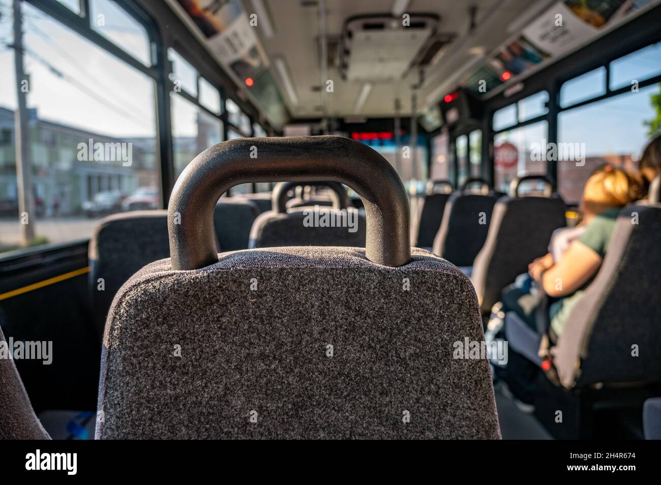 Single mother with children on the way to work in the morning on an ...