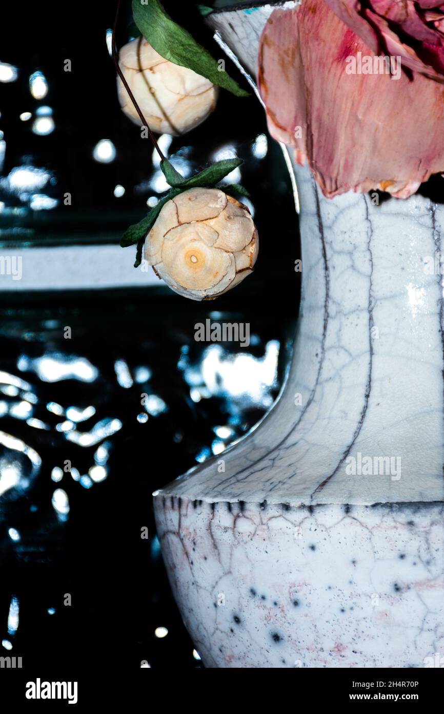 Cracked ceramic vase with dry flowers. vertical view Concept of sadness ...