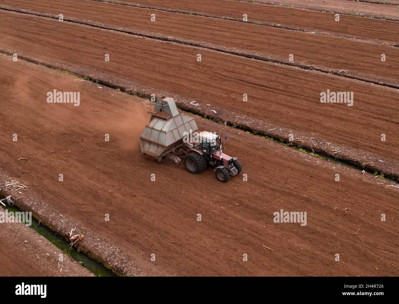 Peat Harvester Tractor on Collecting Extracting Peat. Mining and ...