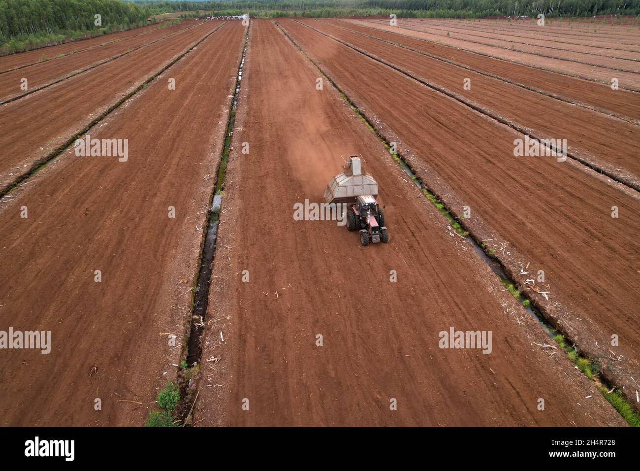 Peat Harvester Tractor on Collecting Extracting Peat. Mining and ...