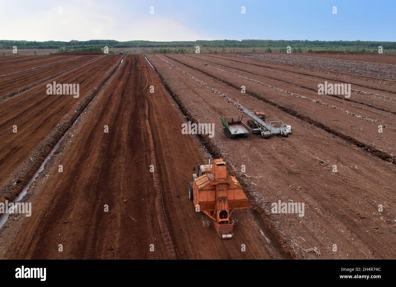 Peat Harvester Tractor on Collecting Extracting Peat. Mining and ...