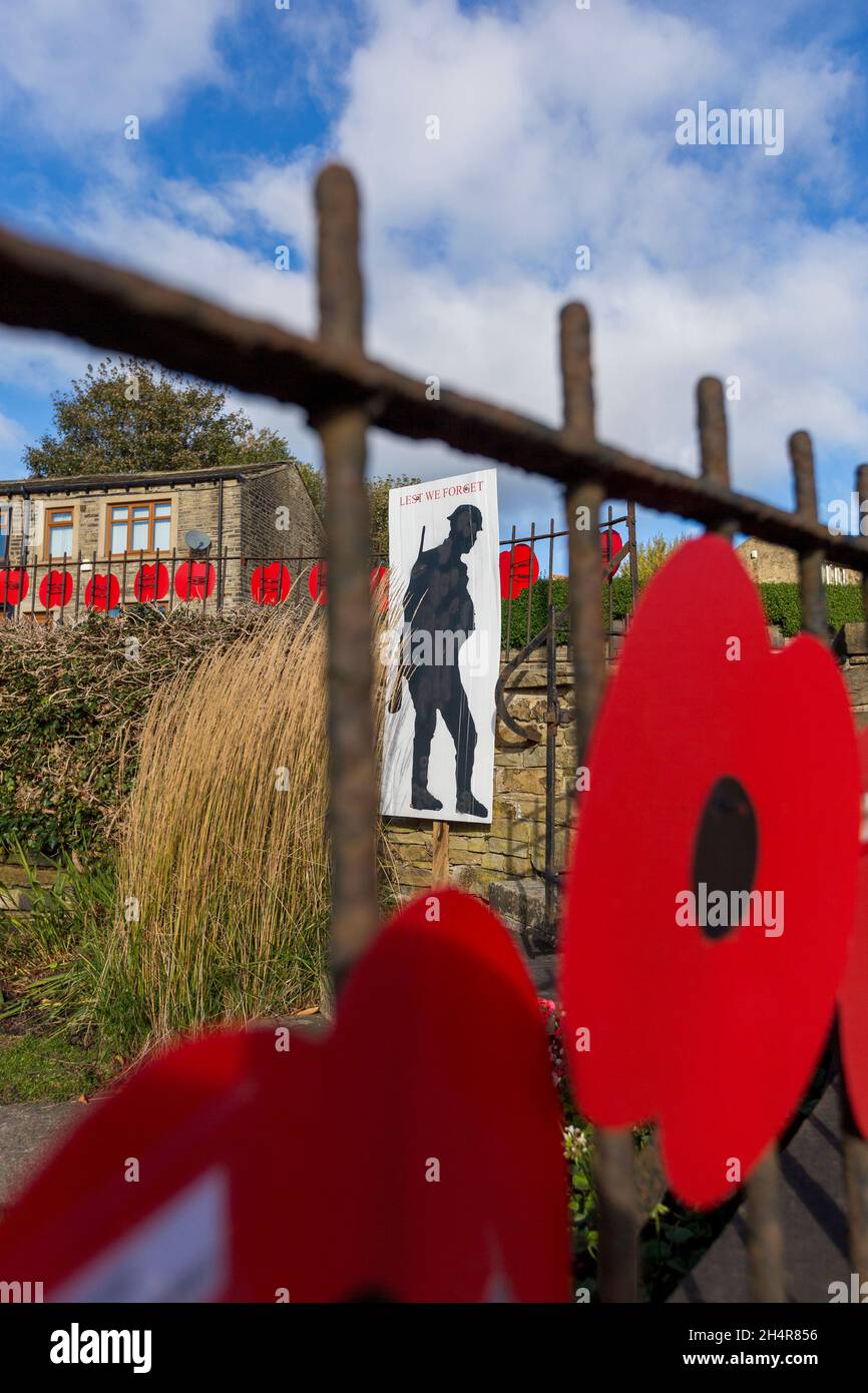 Poppy Day memorials at the war memorial in Shelf, West Yorkshire ...