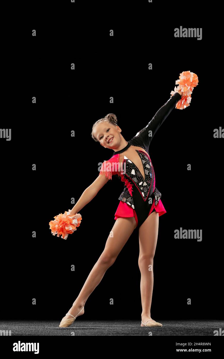 Full-length portrait of beautiful girl, cheerleader training isolated ...