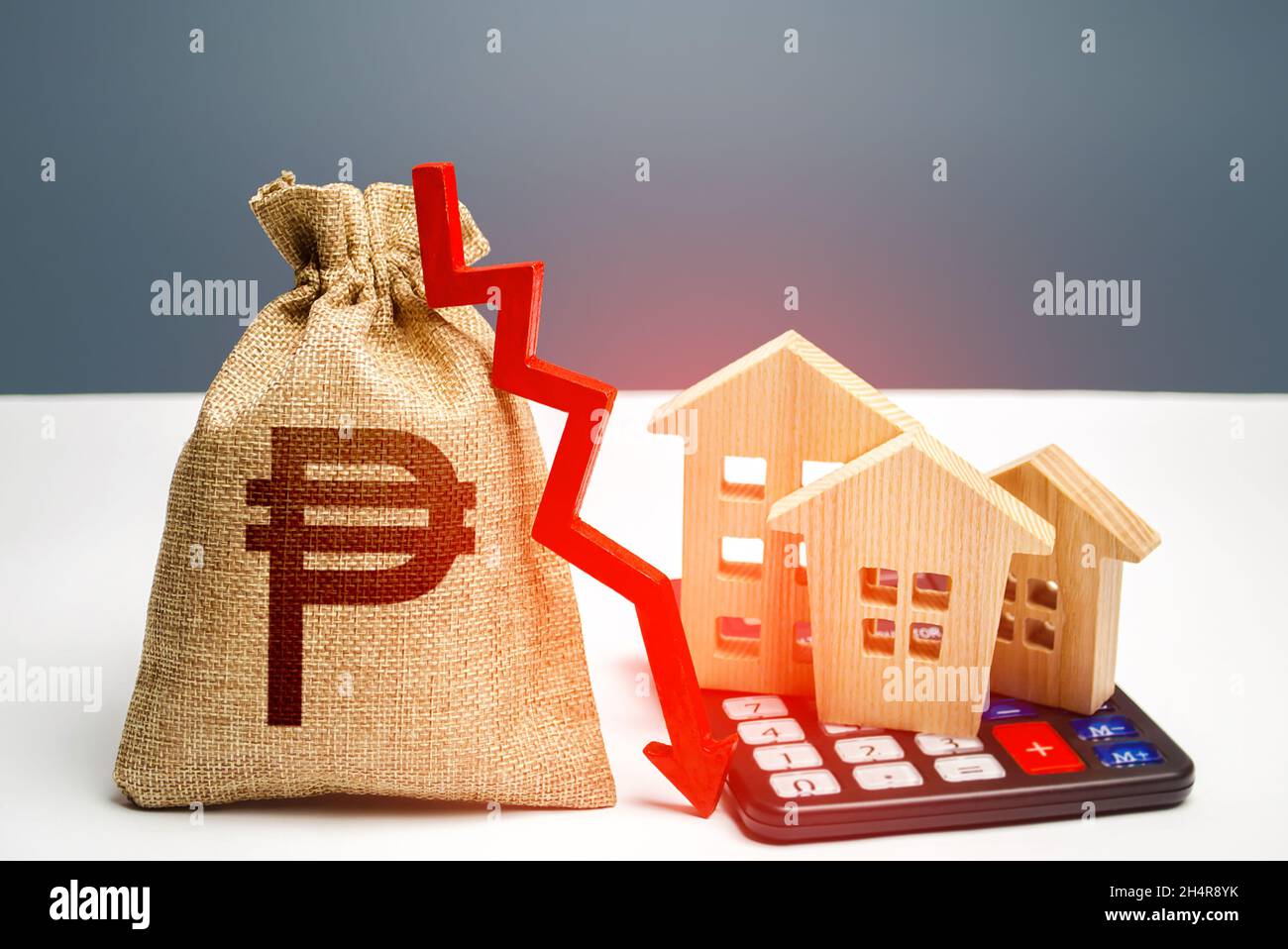 Philippine peso money bag with down arrow and houses on calculator ...