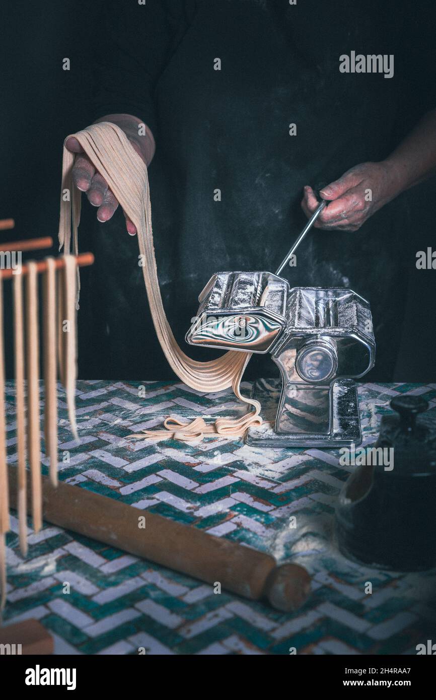 Old woman making pasta Stock Photo - Alamy