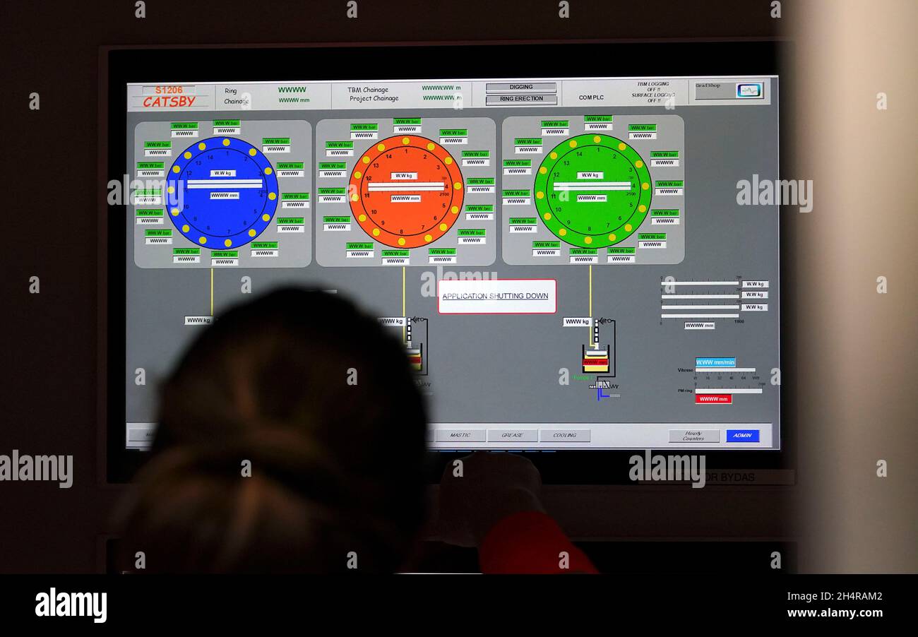 A pilot looks out controls on one of the two tunnelling machines at the ...