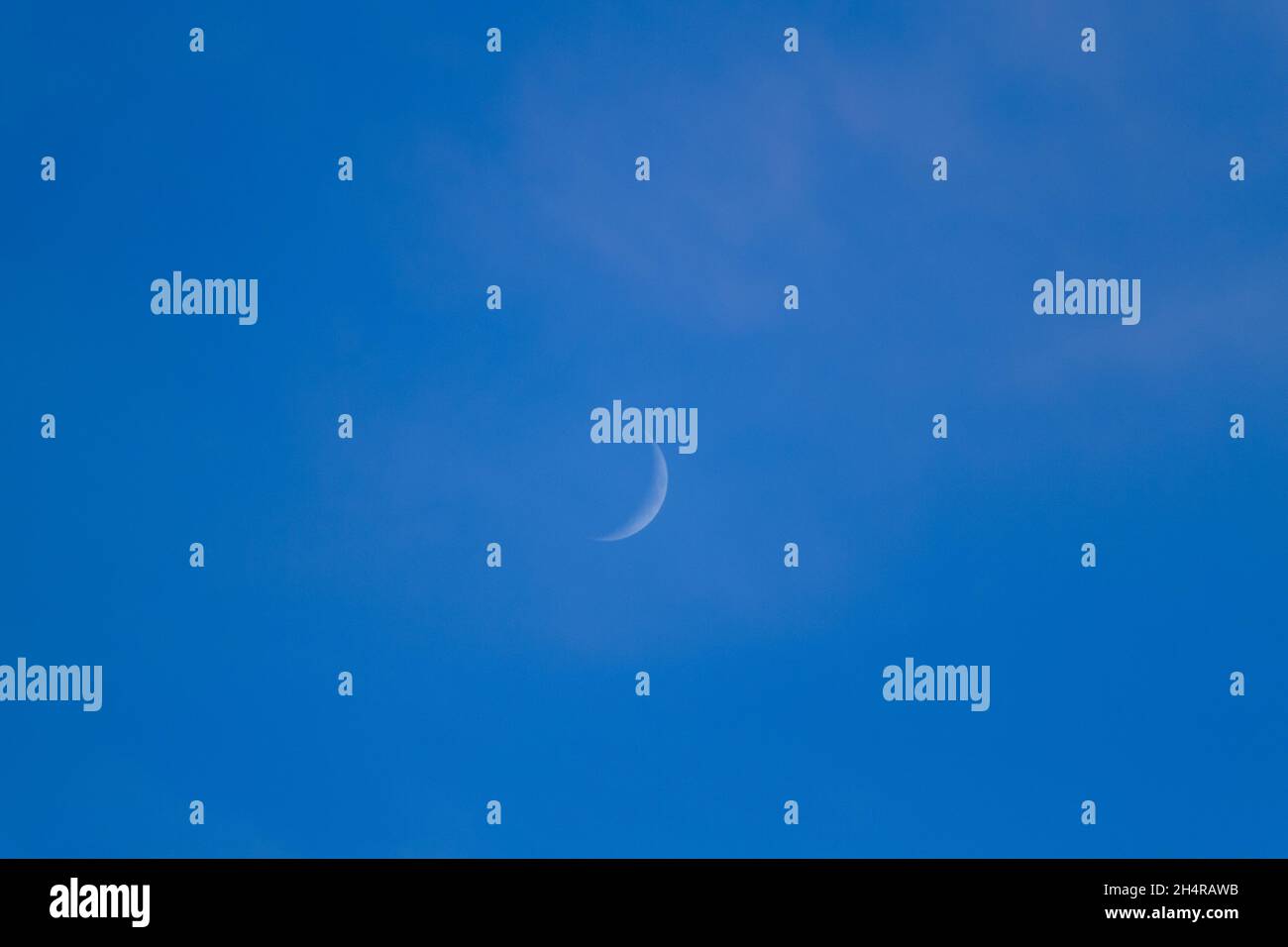 Moon in the deep blue sky Stock Photo - Alamy
